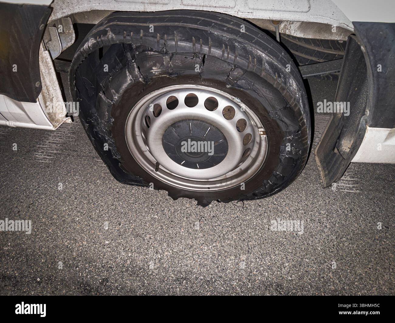 Illustrative photo, burst damaged retread tyre, tread, rear wheel ...