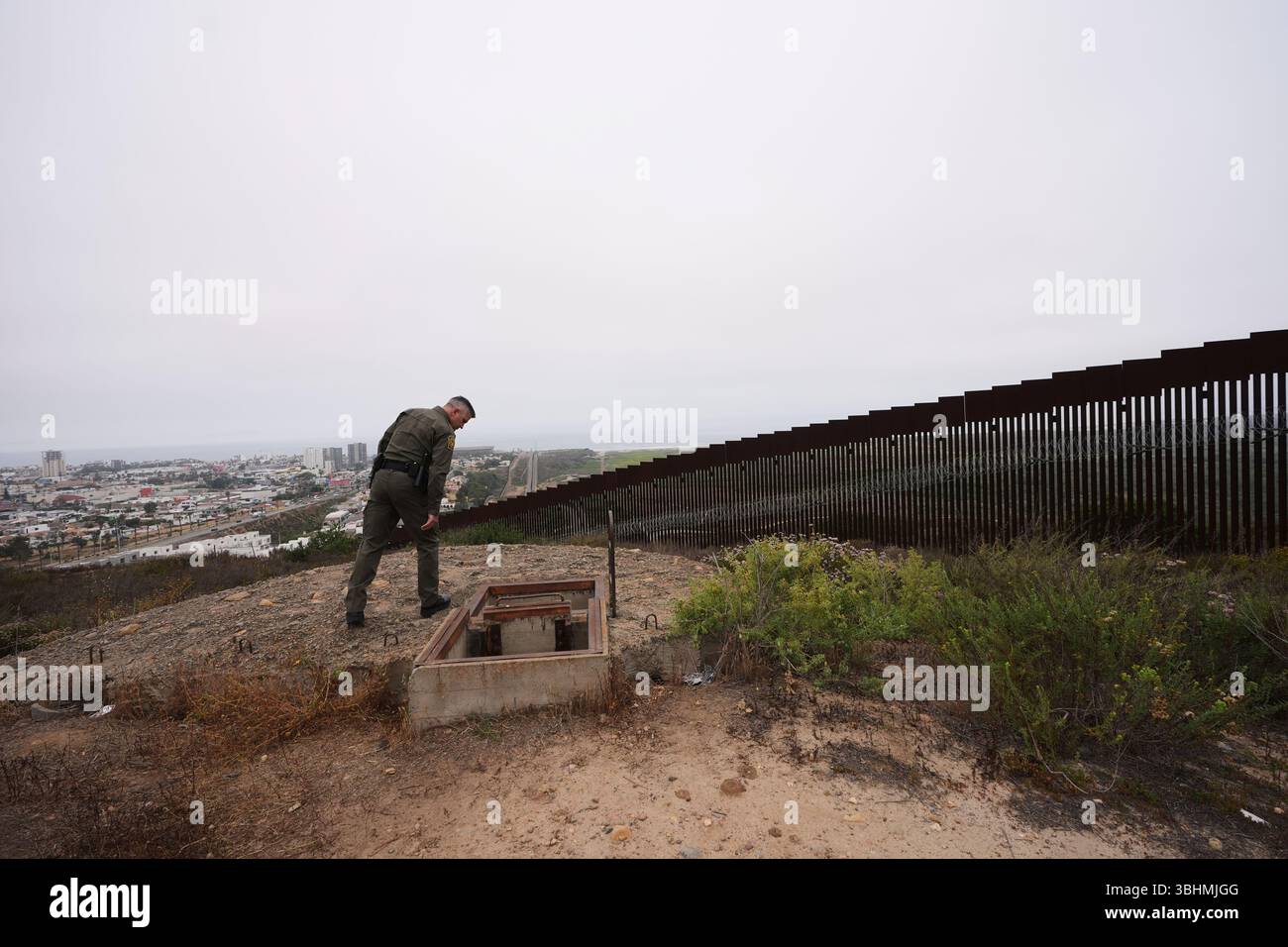 Border Patrol Agent Rood looks into a World War II era bunker in ...