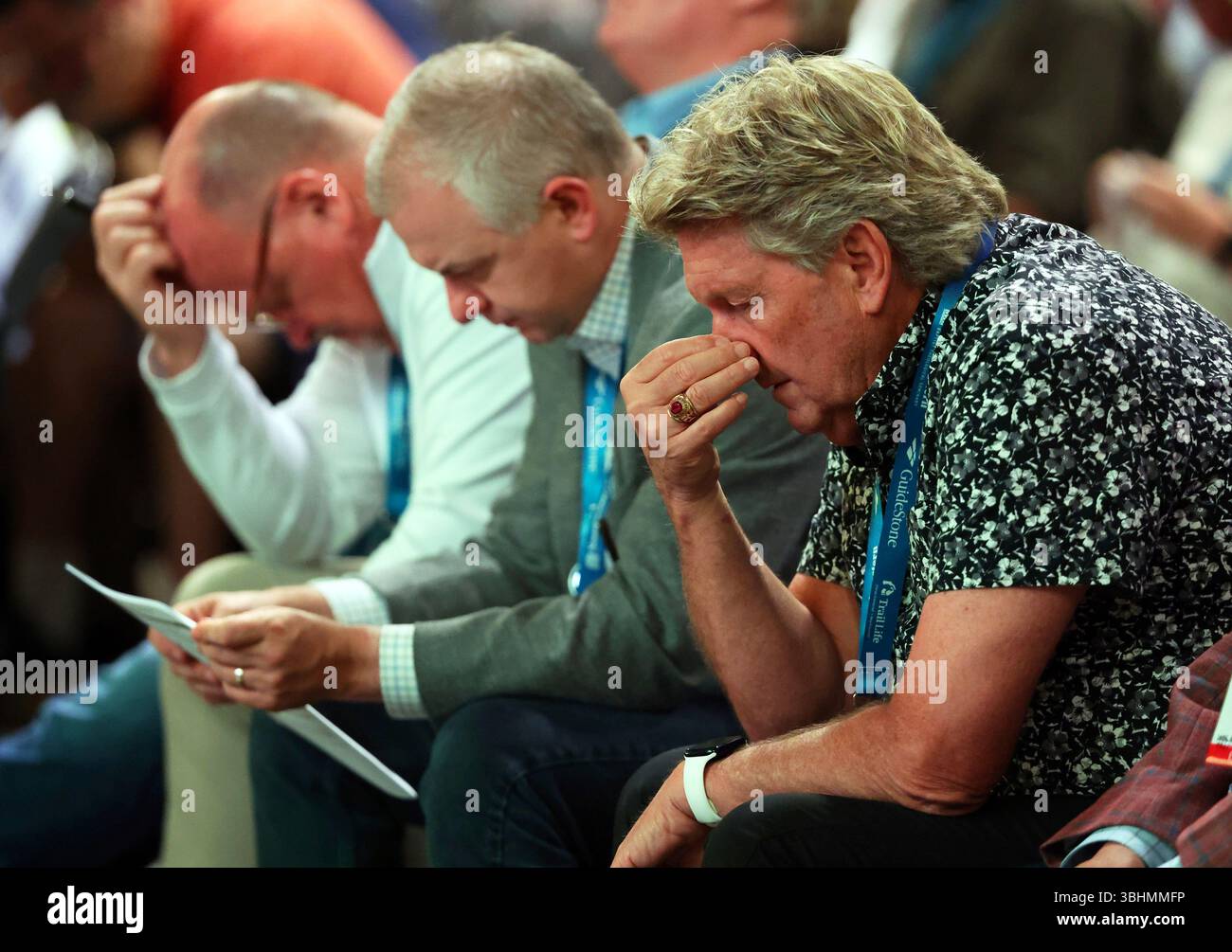 Messengers attending the Southern Baptist Convention bow their heads in ...