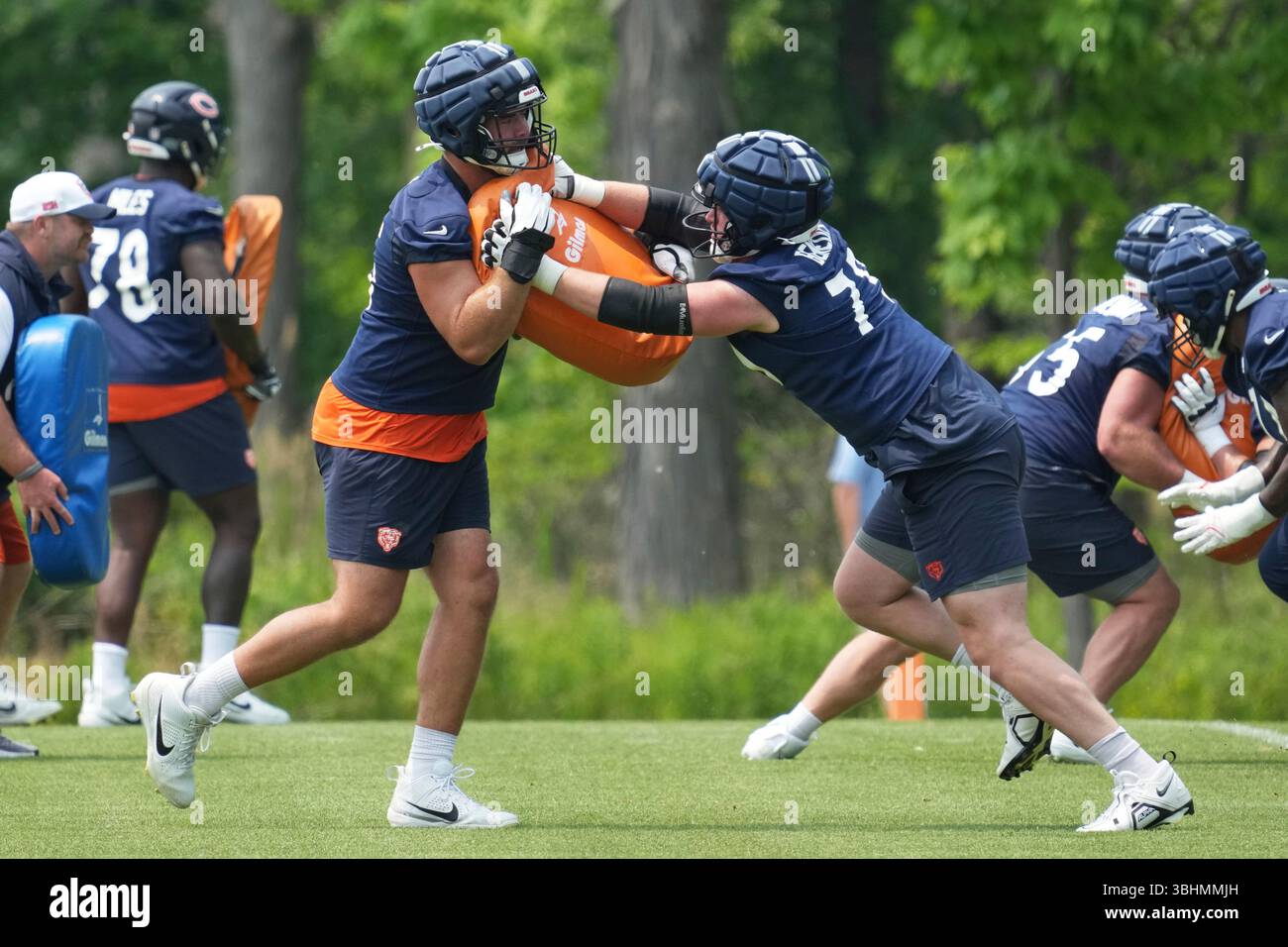 Chicago Bears offensive line Ozzy Trapilo, left, works with offensive ...