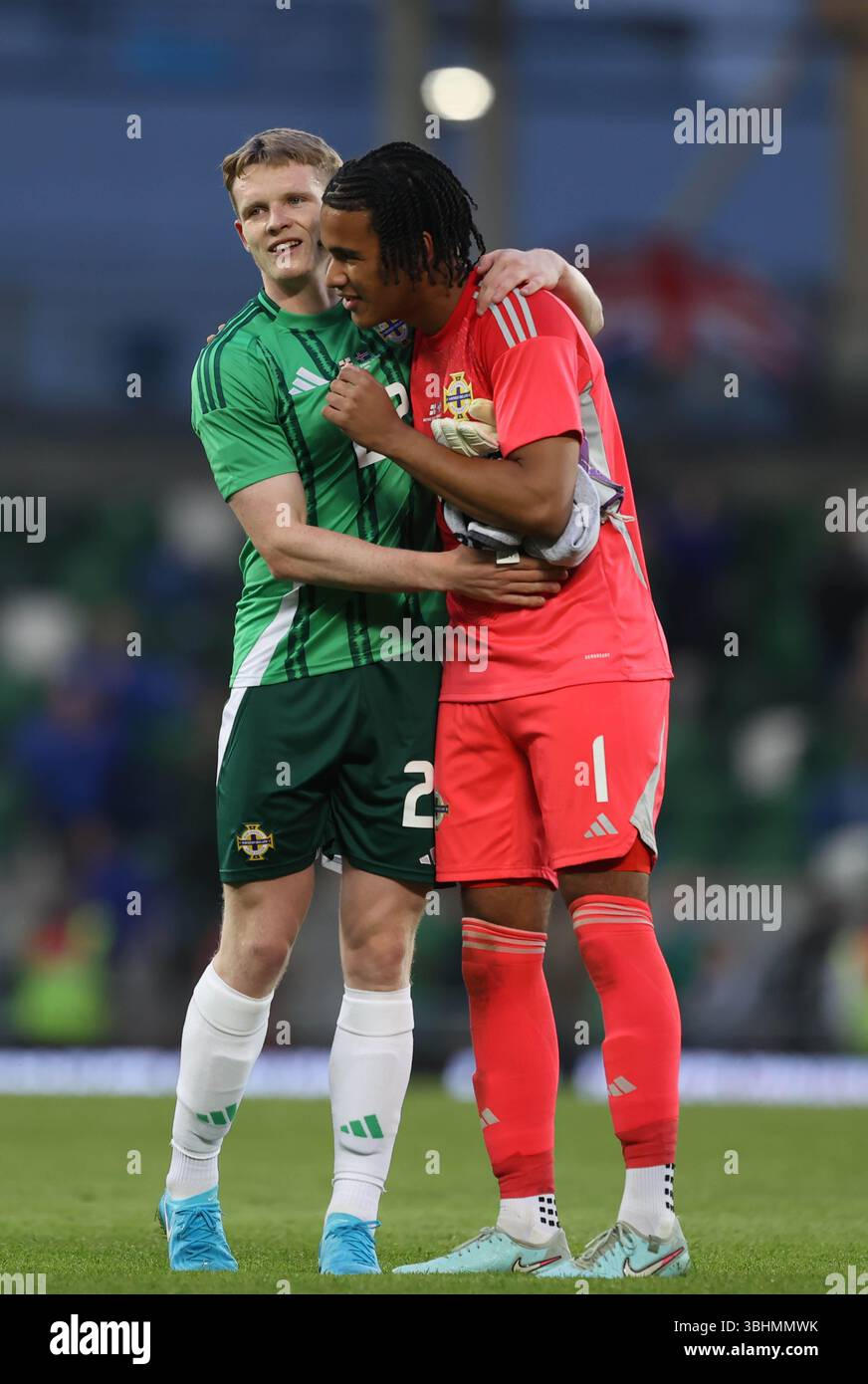 Northern Ireland's Conor Bradley (left) and goalkeeper Pierce Charles ...