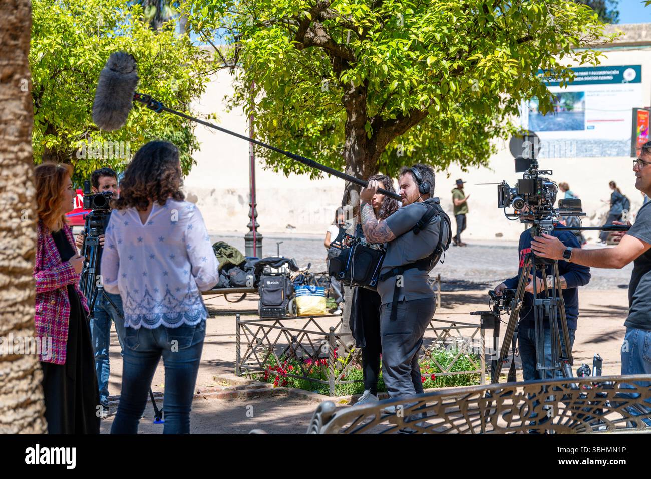 Cordoba, Cordoba - Spain - 04-08-2024: A film crew using a boom ...