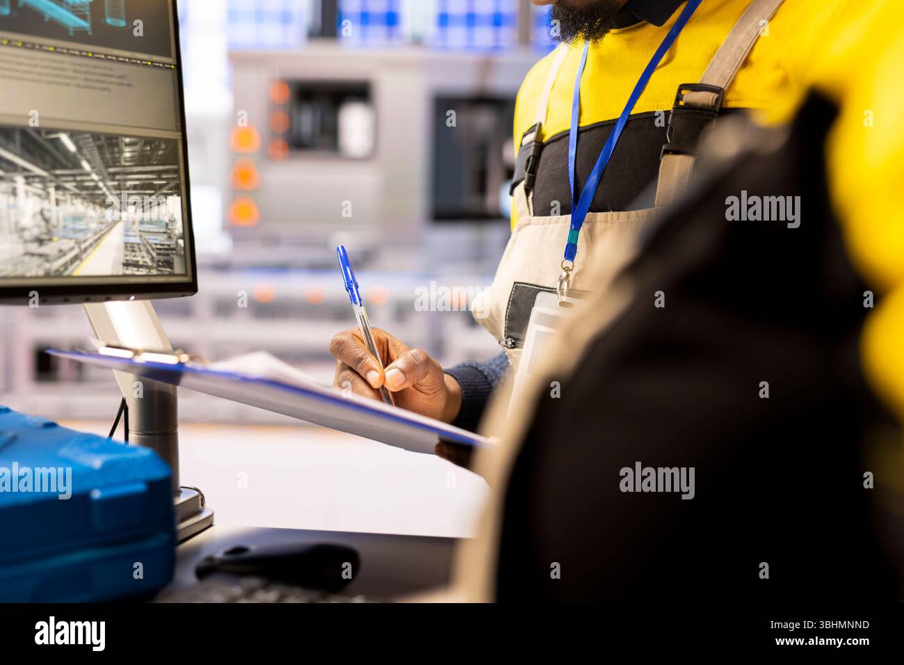 Closeup of professional engineer controlling industrial automation ...