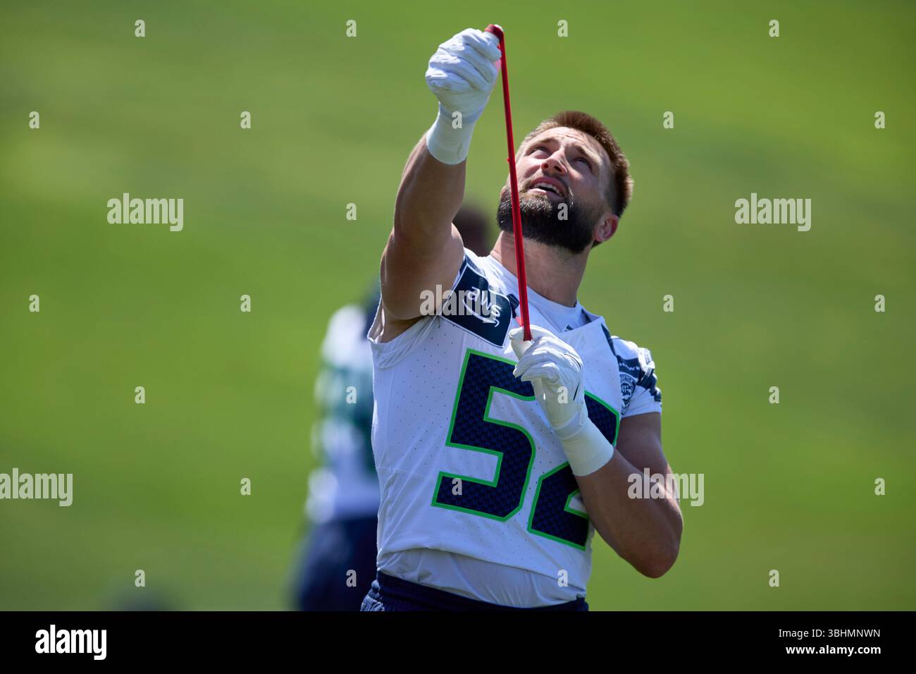 Seattle Seahawks linebacker Patrick O'Connell shoots a stretching band during practice at NFL ...