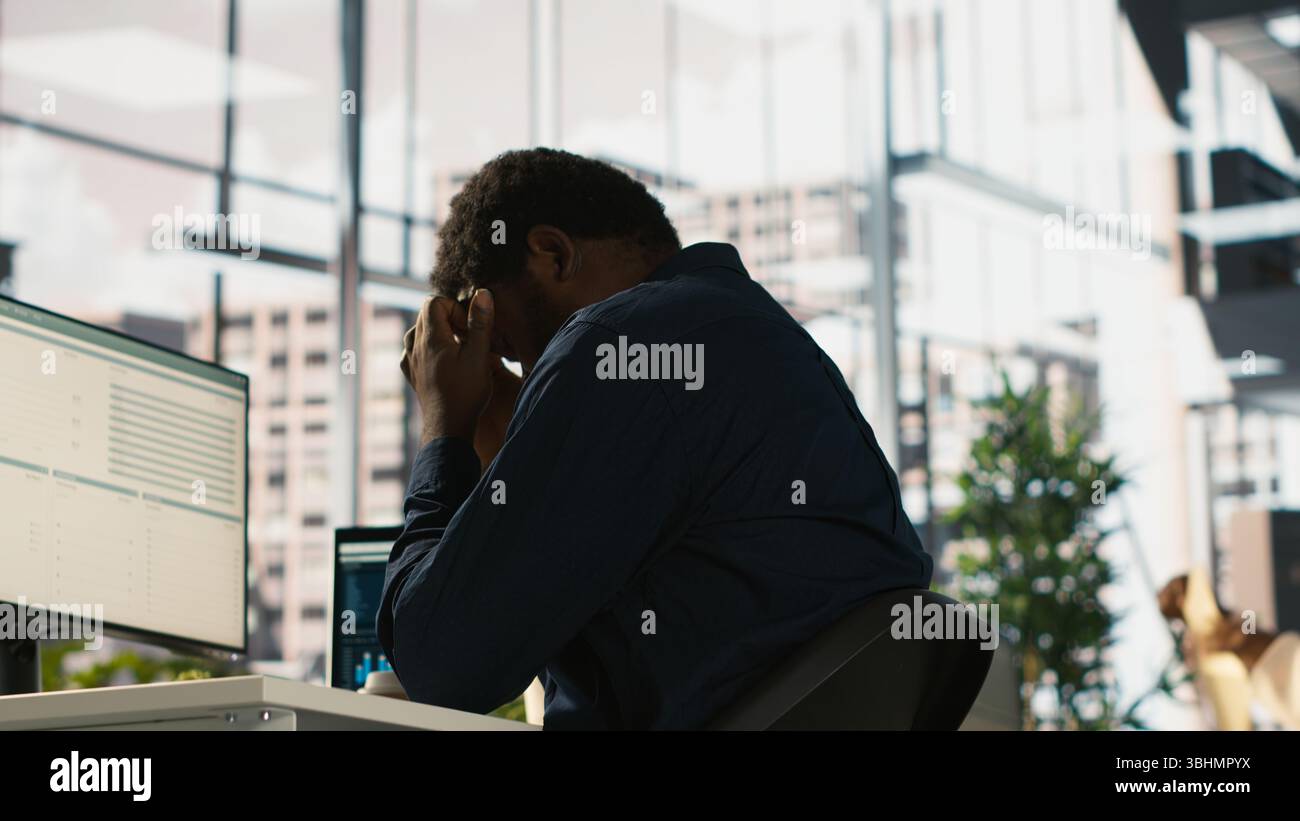 Worker feeling painful headache while working, suffering burnout while ...