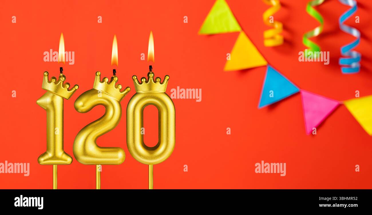 Number 120 candle - Birthday celebration on an orange background with ...