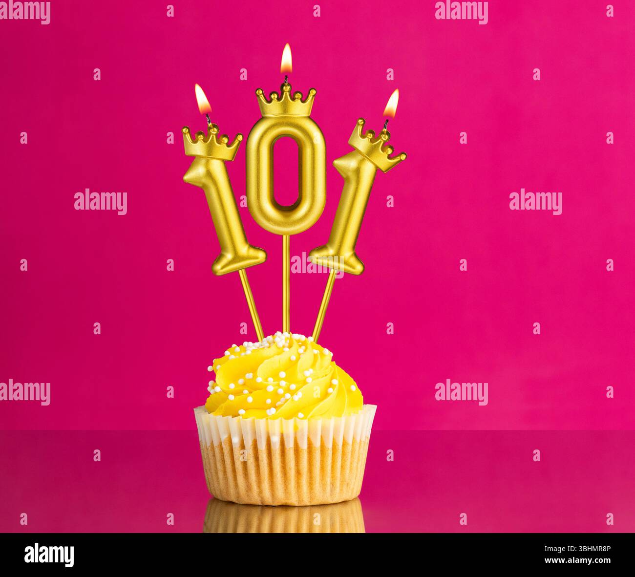 Yellow birthday cupcake with a number 101 candle - Birthday card on a ...