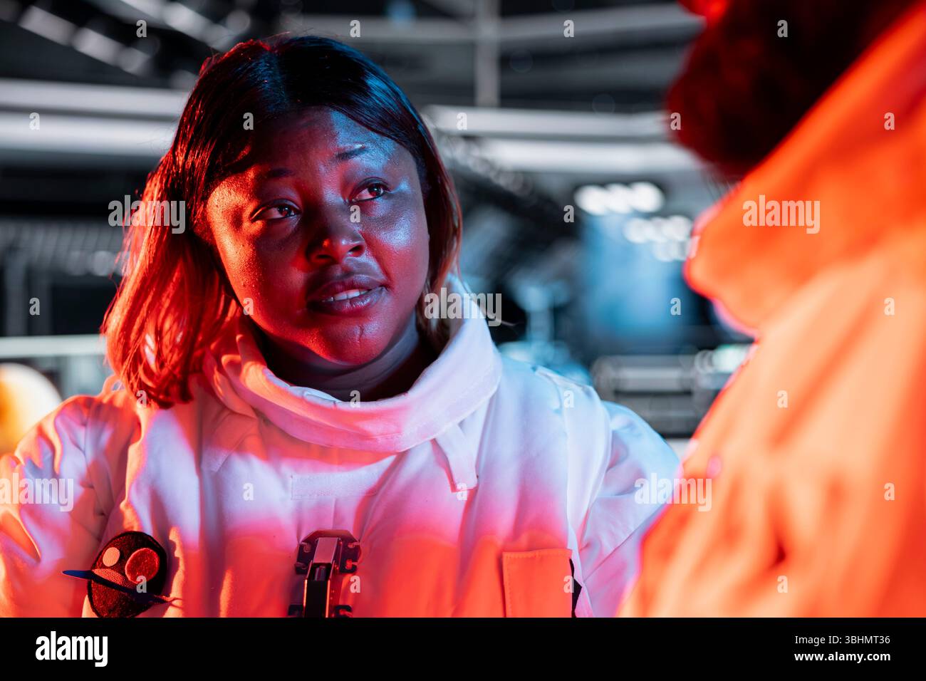 Team of spaceship engineers following danger protocol to fix security breach causing overload ...