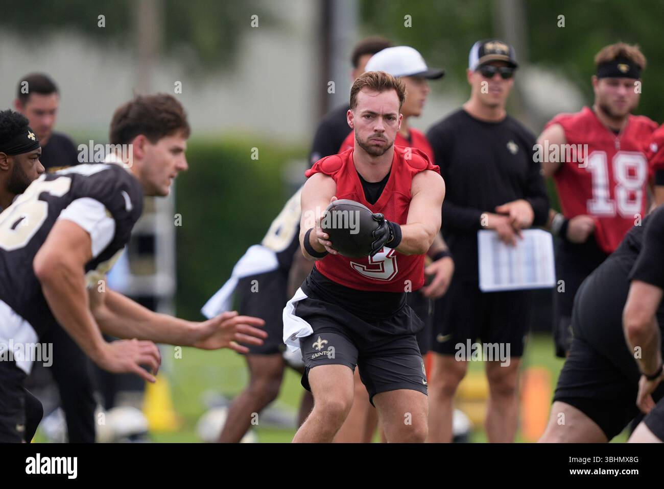 New Orleans Saints quarterback Jake Haener runs through drills during ...