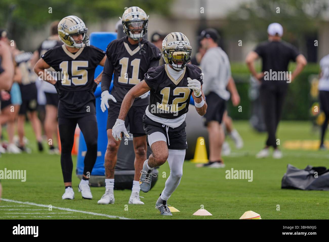 New Orleans Saints wide receiver Chris Olave (12) goes through drills during practice at NFL ...