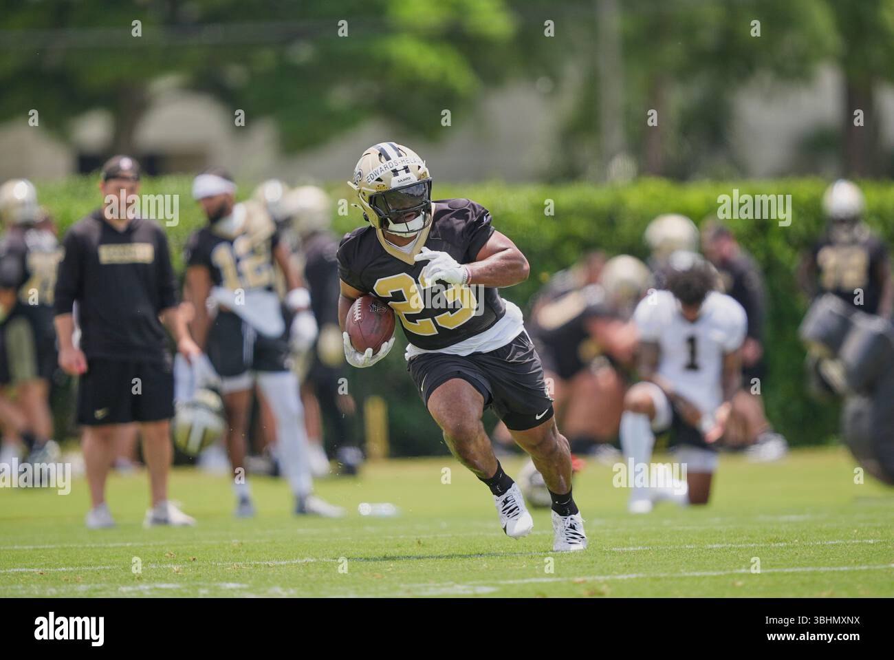 New Orleans Saints running back Clyde Edwards-Helaire (23) goes through ...
