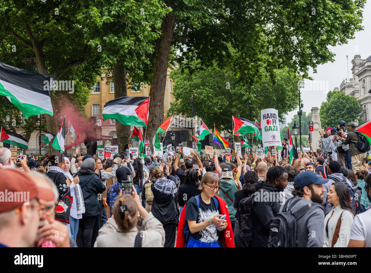 London, UK. 09 JUN, 2025. Red flares are set off as protestors gathered ...