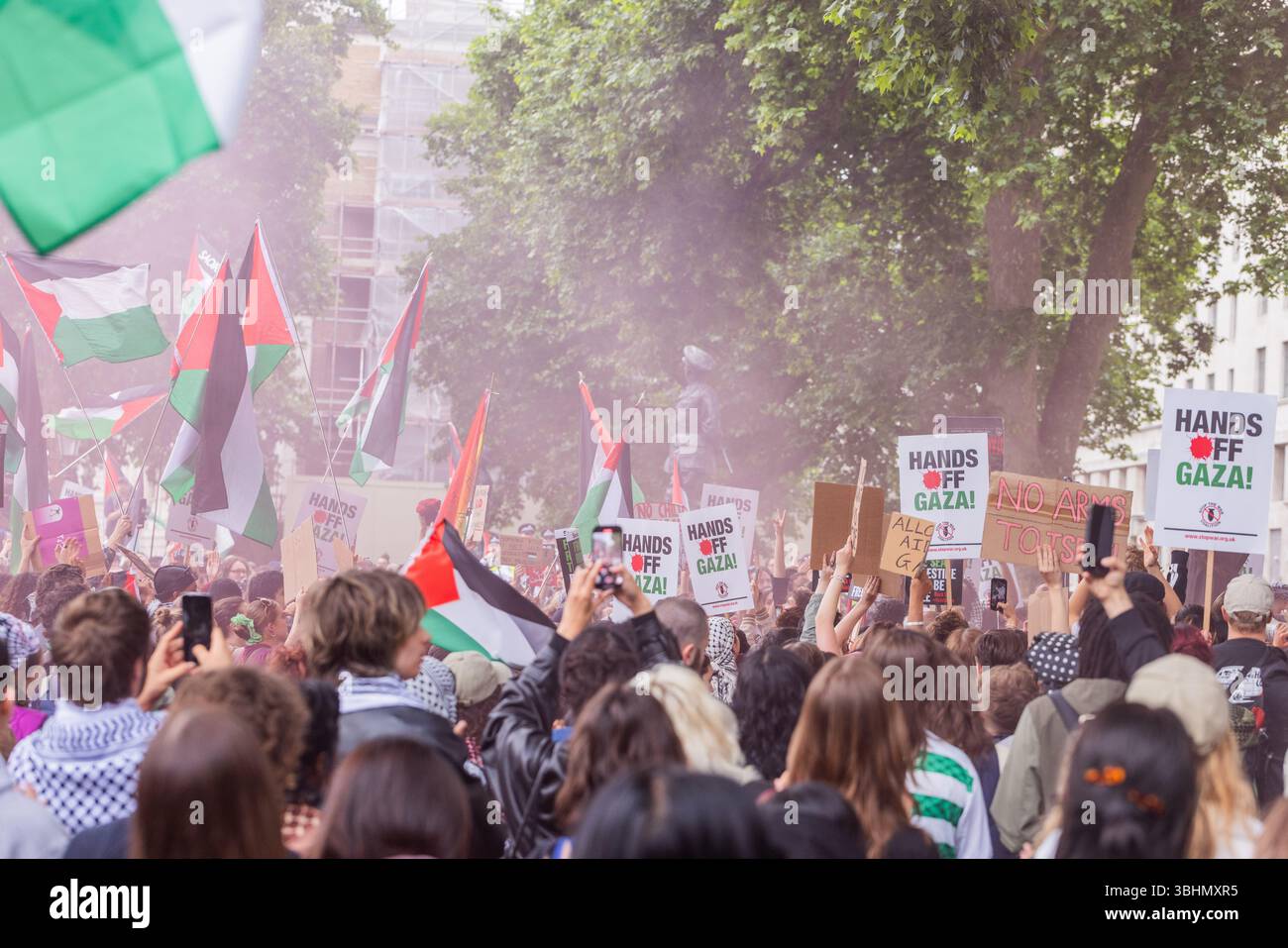 London, UK. 09 JUN, 2025. Red flares are set off as protestors gathered ...