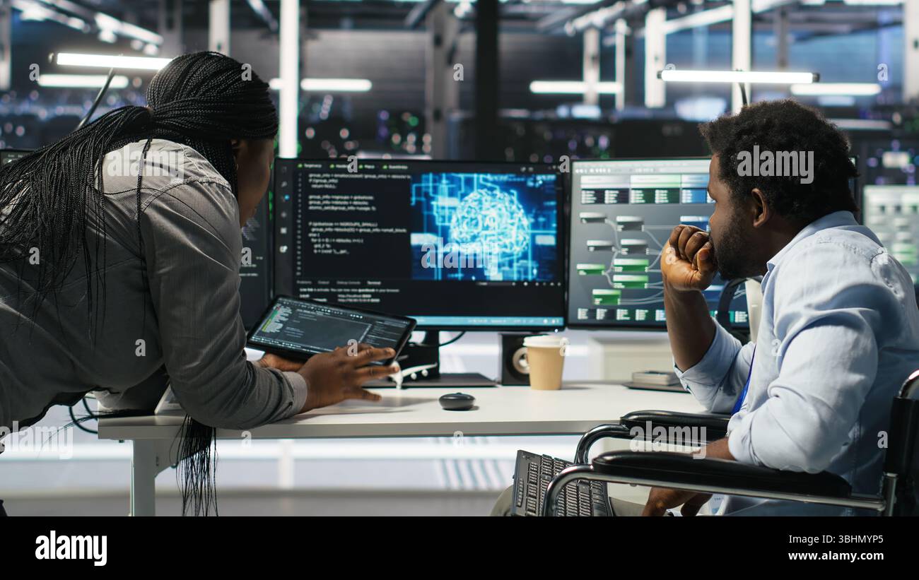 Data center admin in wheelchair hi-res stock photography and images - Alamy