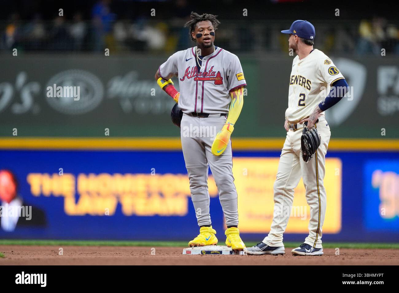 Atlanta Braves' Ronald Acuña Jr. talks with Milwaukee Brewers' Brice ...