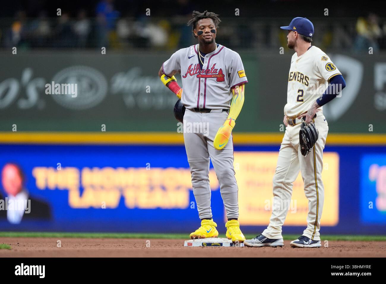 Atlanta Braves' Ronald Acuña Jr. talks with Milwaukee Brewers' Brice ...