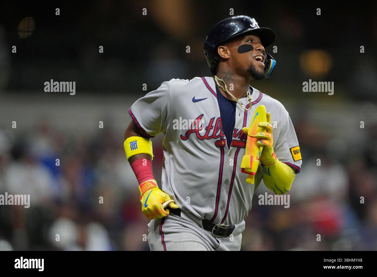 Atlanta Braves' Ronald Acuña Jr. smiles as he jogs to first base during ...