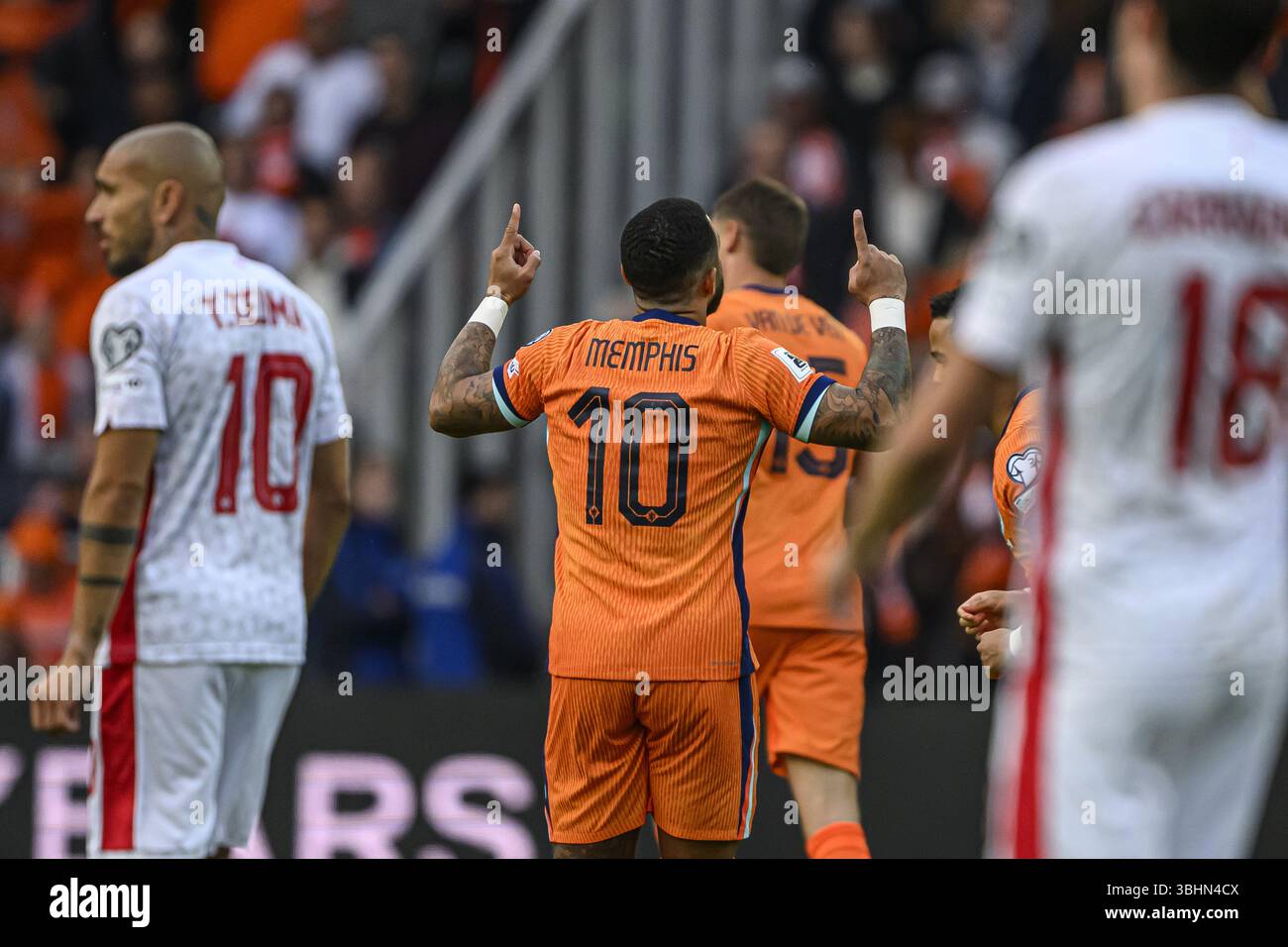 GRONINGEN - (l) Teddy Teuma of Malta (r) a celebrate Memphis Depay of ...