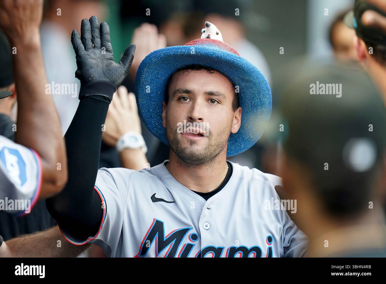 Miami Marlins' Nick Fortes celebrates in the dugout after hitting a two ...