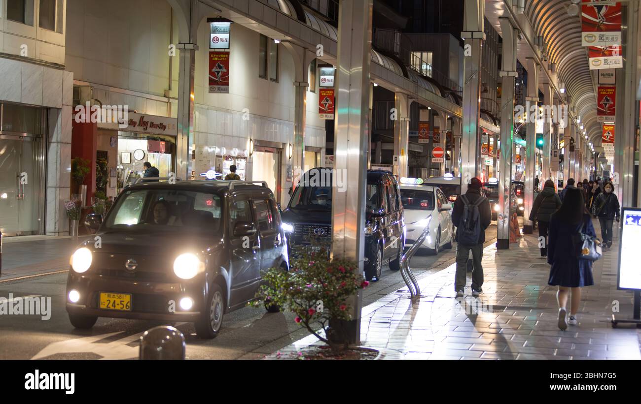 Kumamoto, Japan January 15 2025: pedestrians walk near the Tsuruya ...