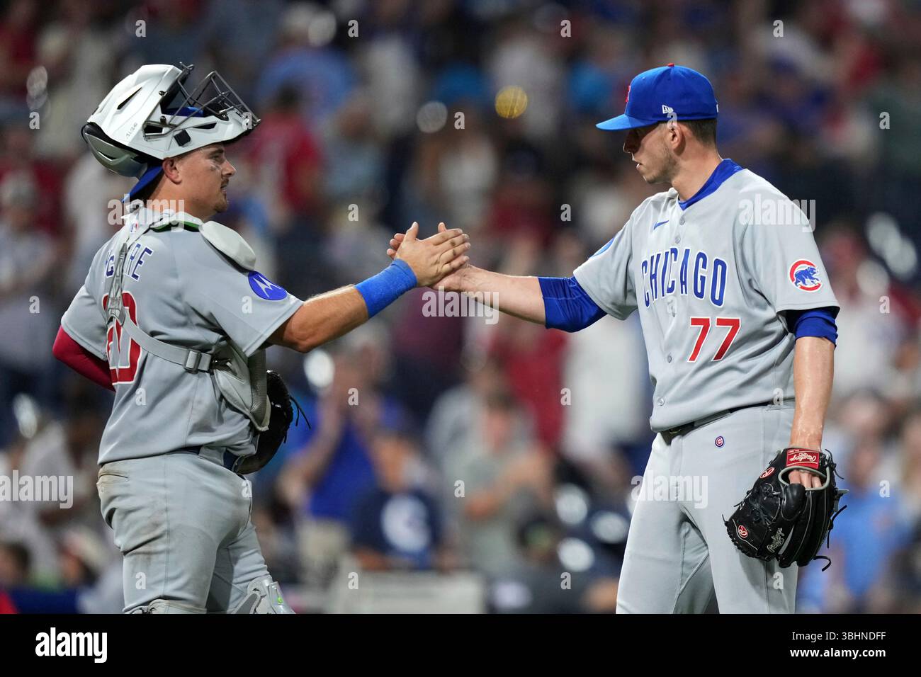 Chicago Cubs catcher Reese McGuire, left, and pitcher Chris Flexen ...