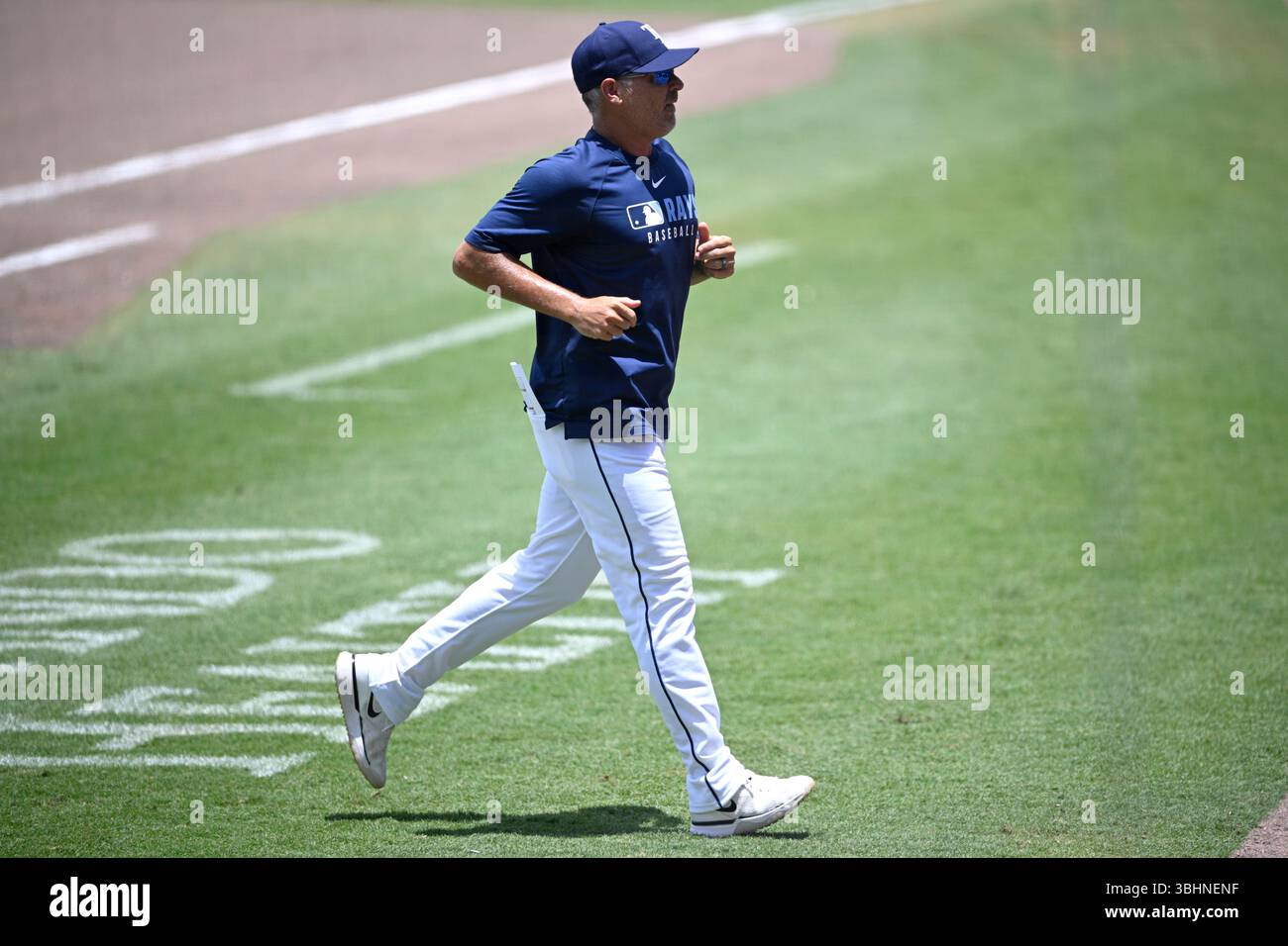 Tampa Bay Rays manager Kevin Cash jogs back to the dugout after making ...