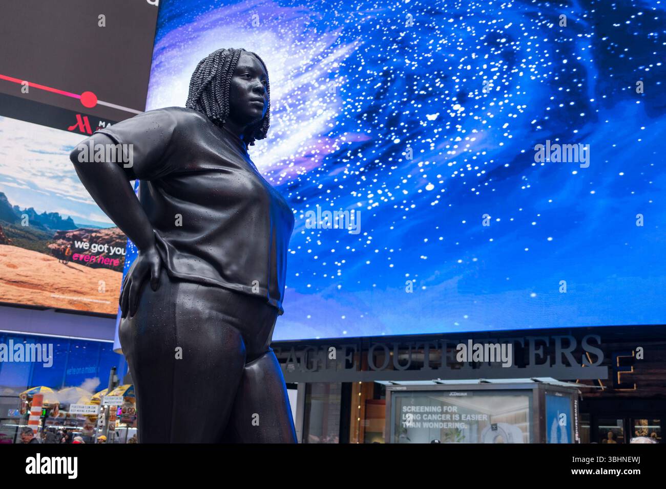 A 12-foot young black woman's bronze statue, titled 'Grounded in the ...