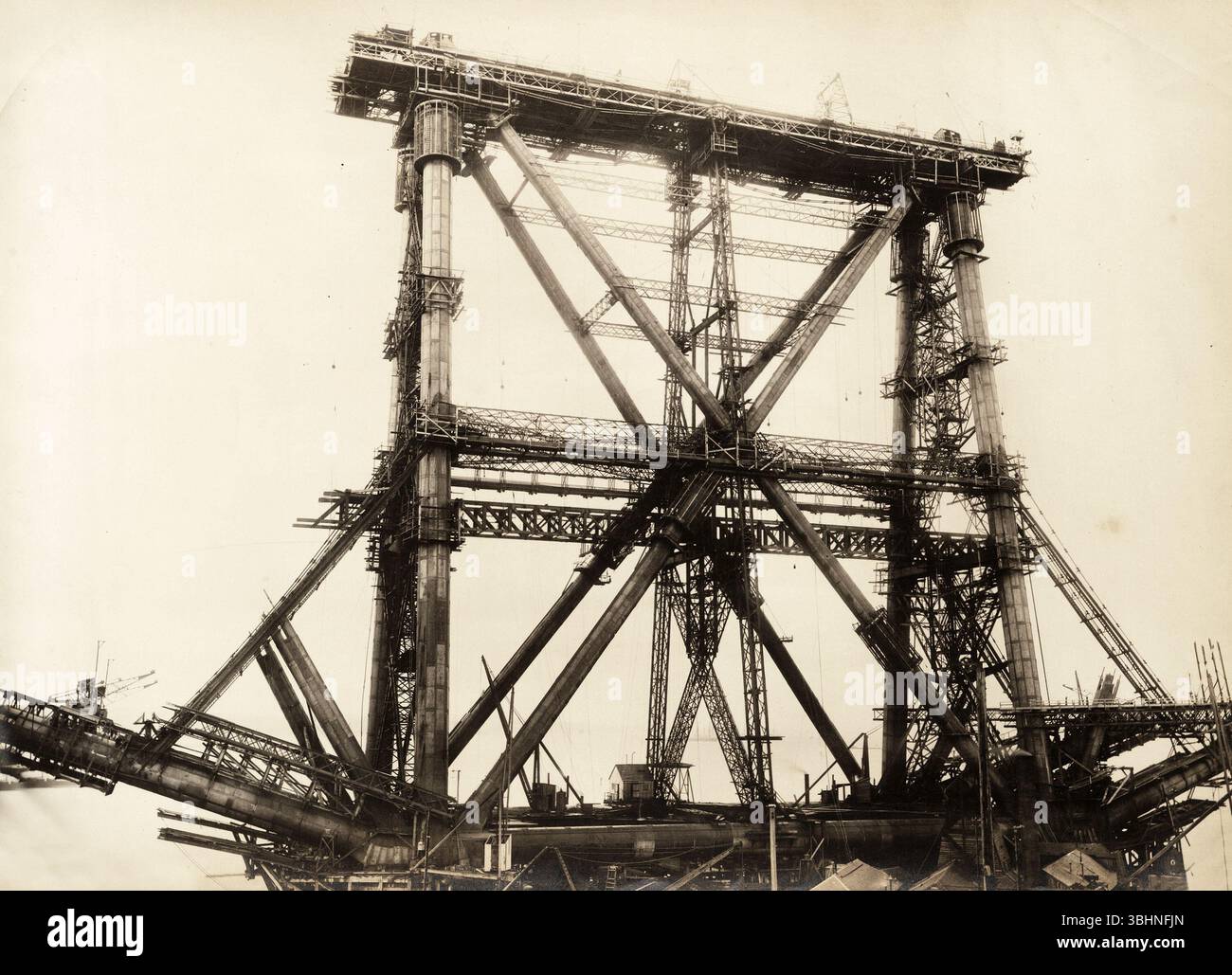 The construction of the Forth Bridge showing the Inchgarvie Cantilever ...