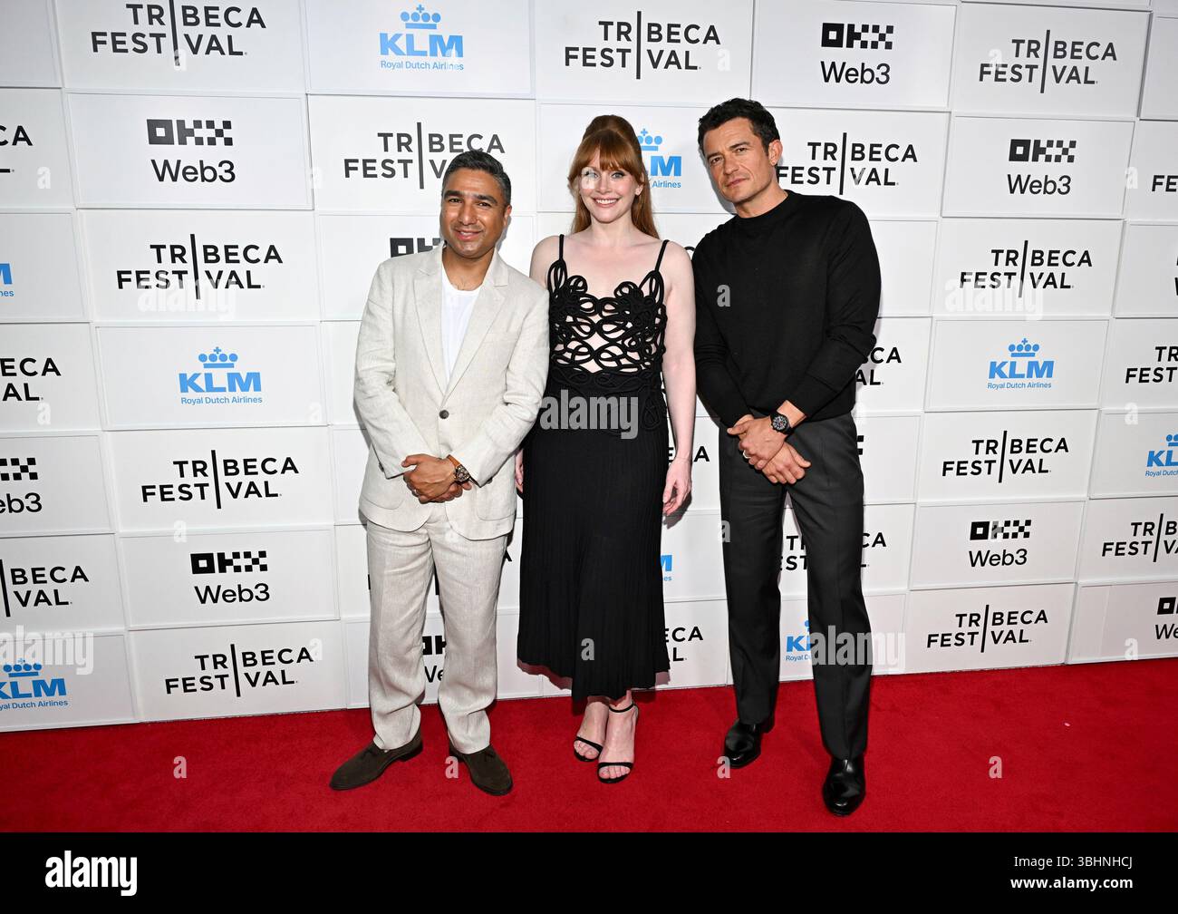 Nick Mohammed, left, Bryce Dallas Howard and Orlando Bloom attend the "Deep Cover" premiere at ...