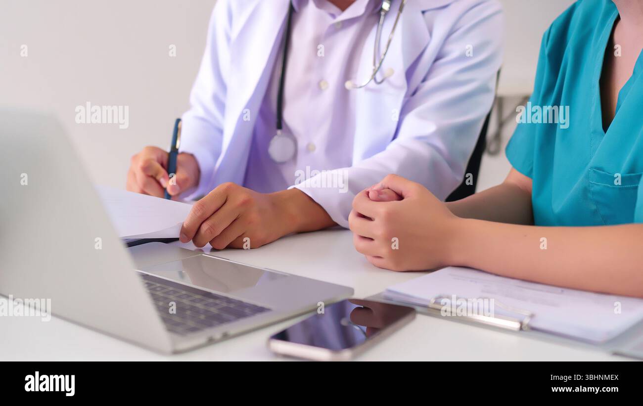 Doctor nurse reviewing test result hi-res stock photography and images ...
