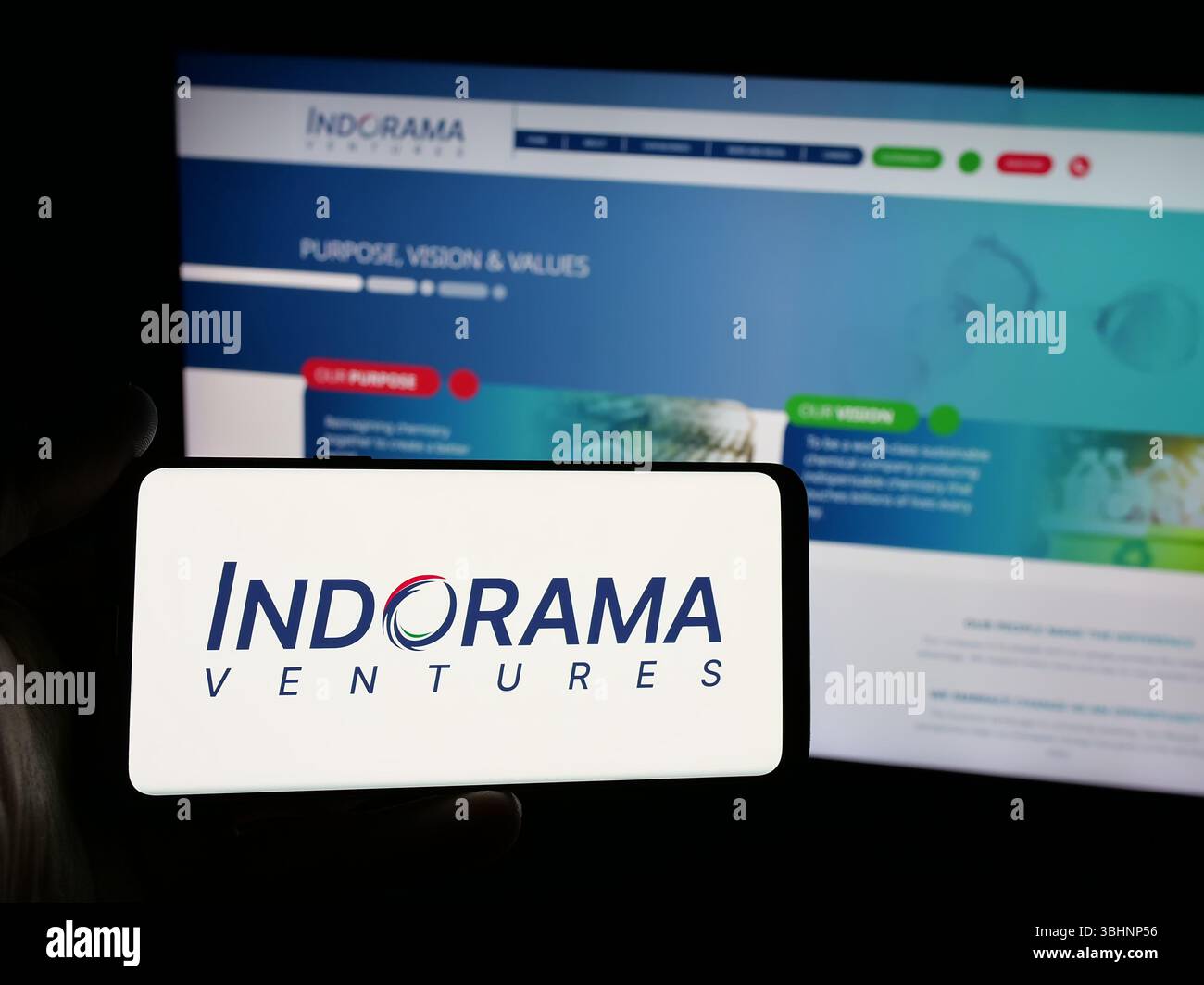 Stuttgart, Germany - 03-19-2025: Person holding smartphone with logo of Thai petrochemical ...