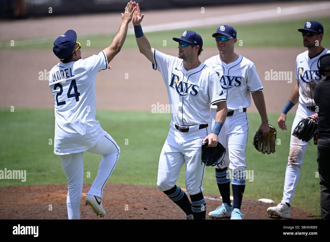 Tampa Bay Rays outfielder Christopher Morel (24) and outfielder Kameron ...
