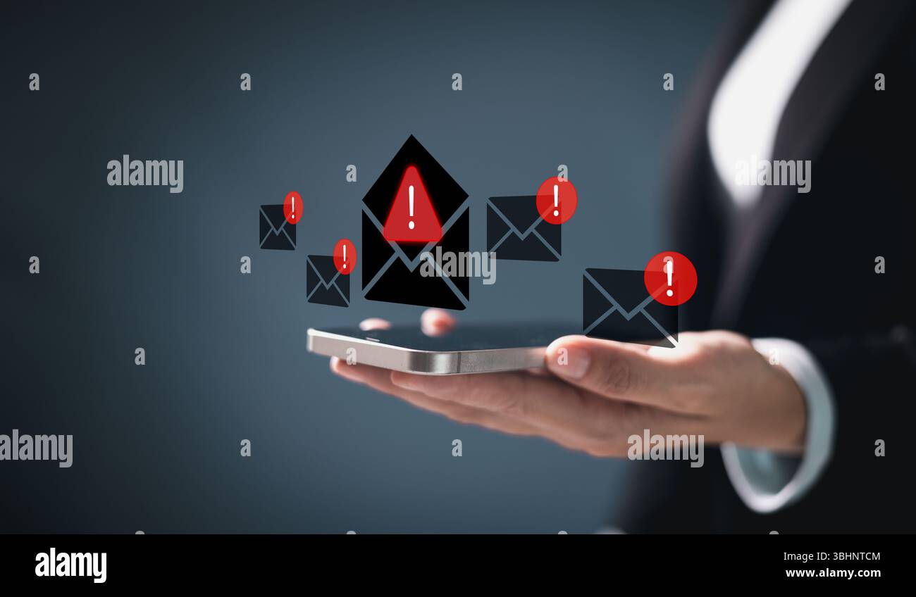 Phishing email alert concept with person using smartphone while ...