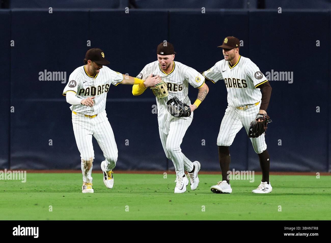From left to right, San Diego Padres' Tyler Wade, Jackson Merrill ...