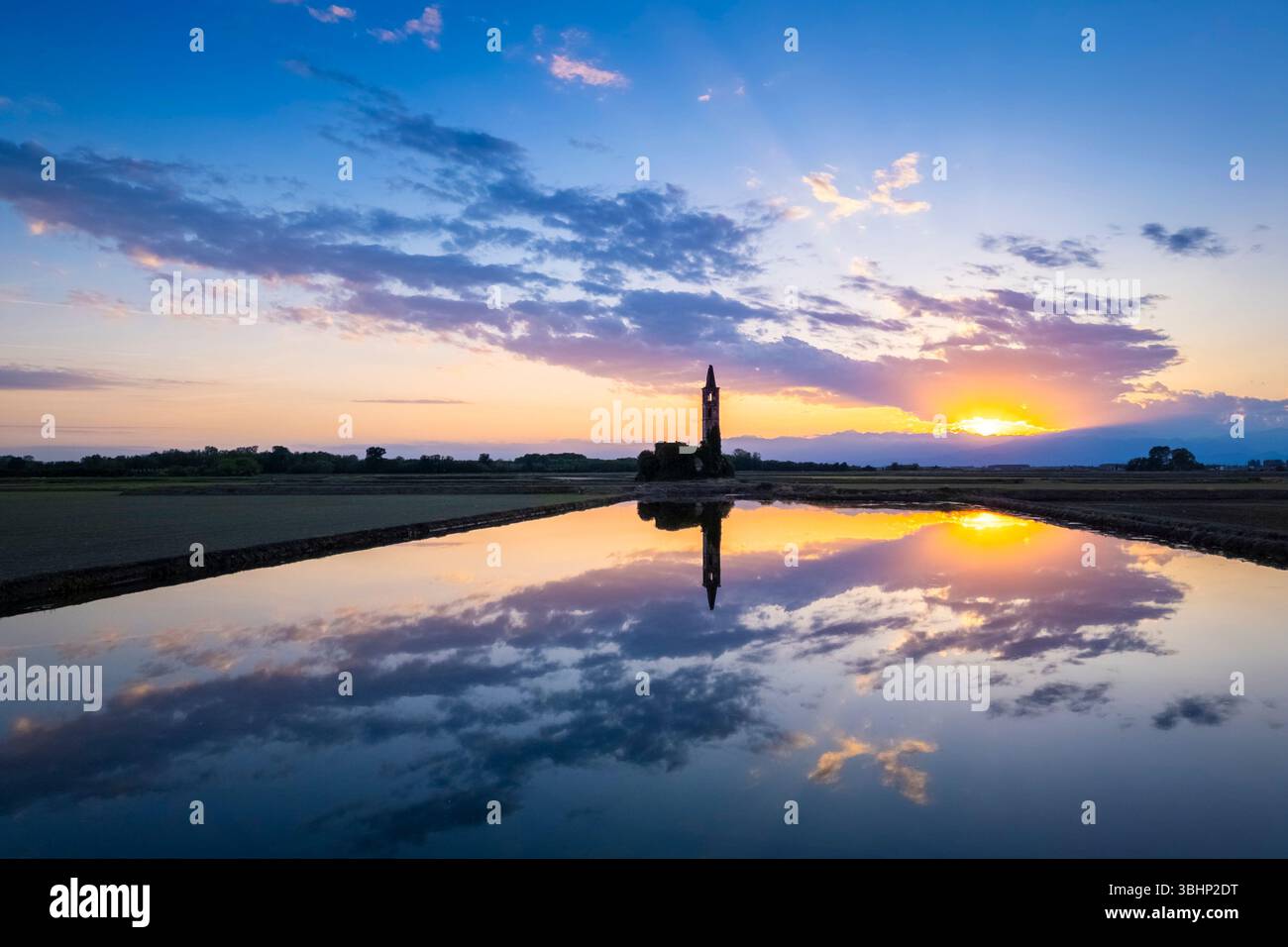 Sunset over the rice fields and abandoned church of Sant'Antonio ...