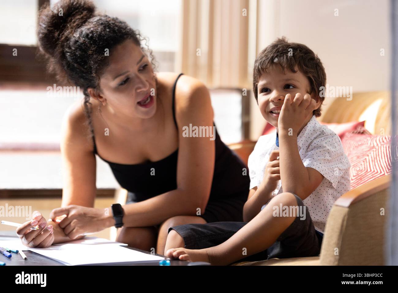 Babysitter explaining homework preschool hi-res stock photography and ...
