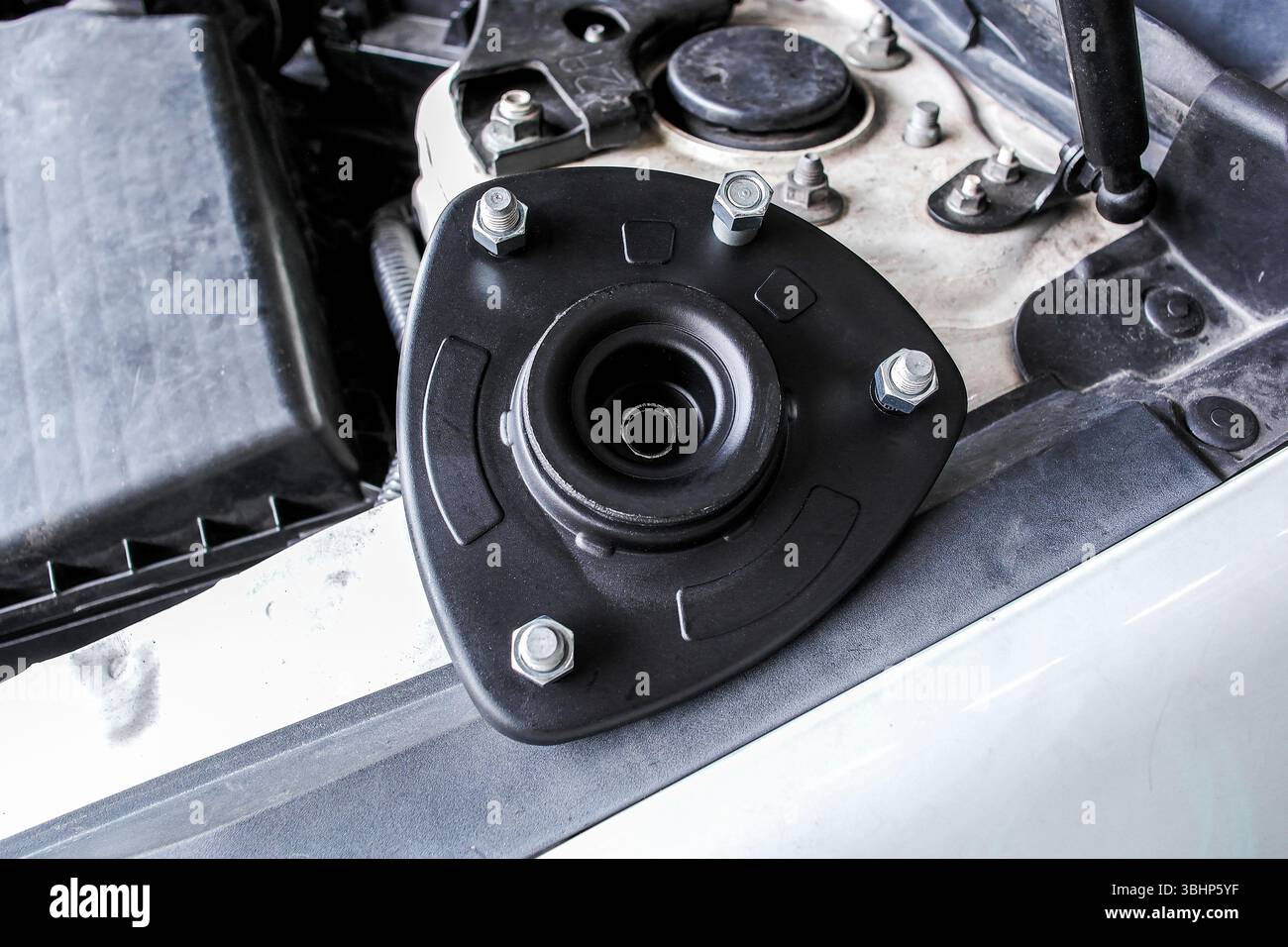Upper strut mount or suspension strut mount, strut component on engine ...