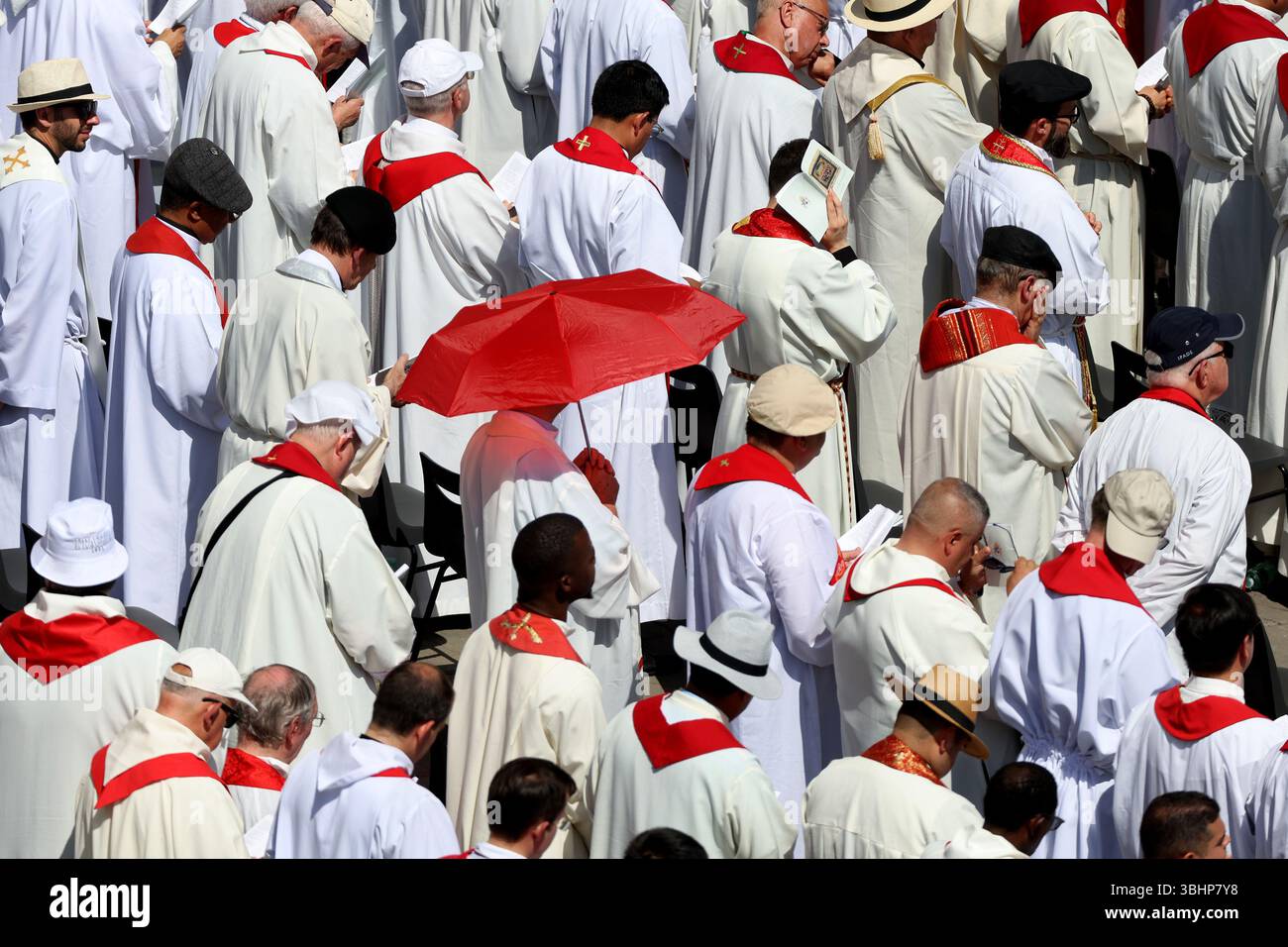 Vatican City, Italy June 8, 2025: priests under the sun cover ...