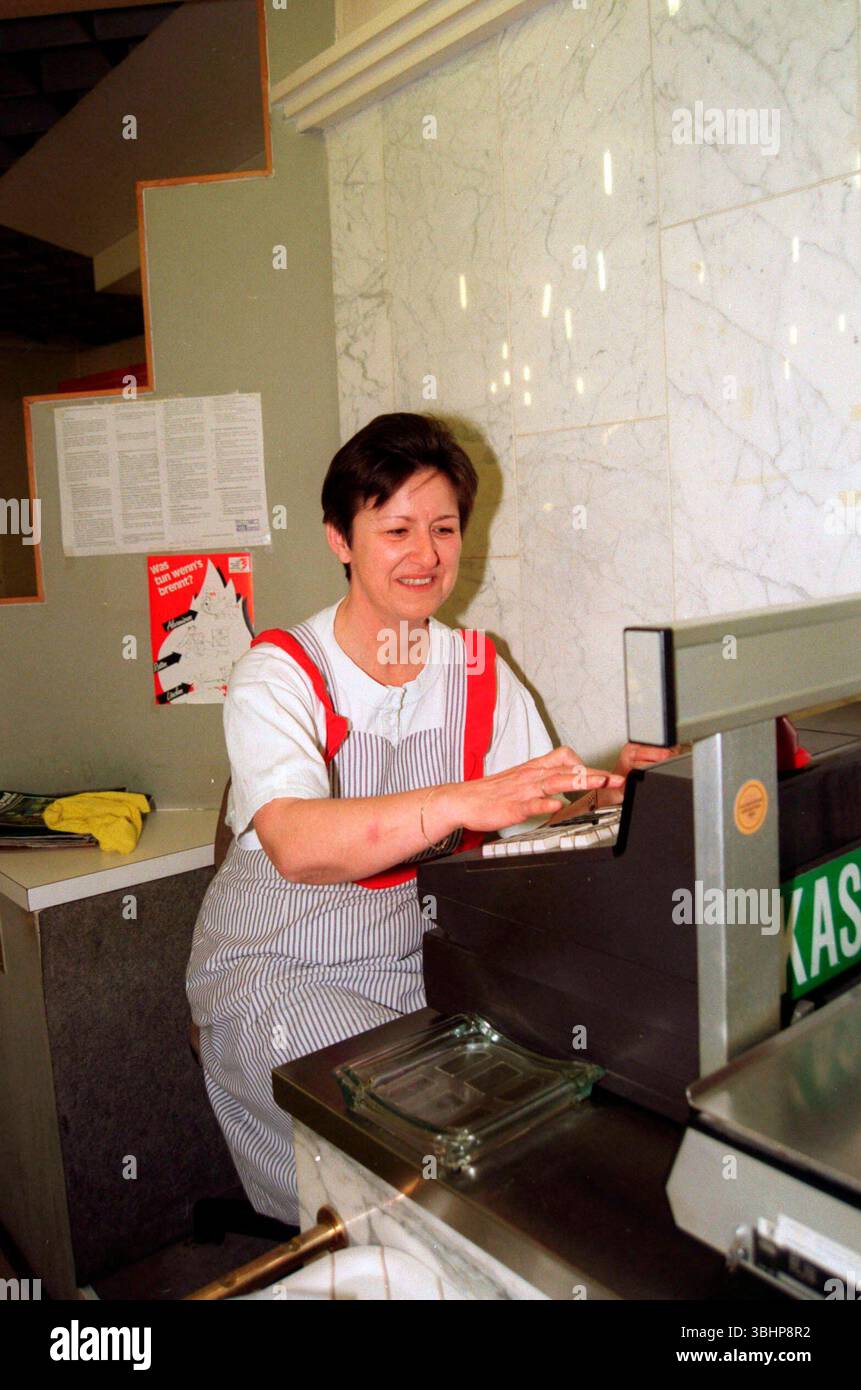female cashier working at the cash desk in a store female cashier at ...
