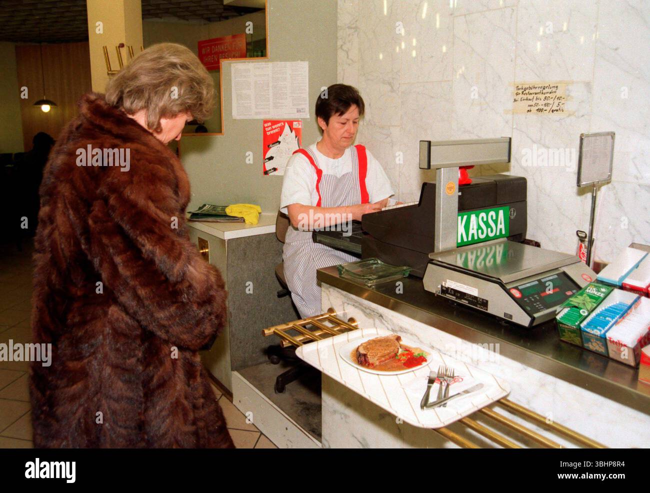 female cashier working at the cash desk in a store female cashier at ...