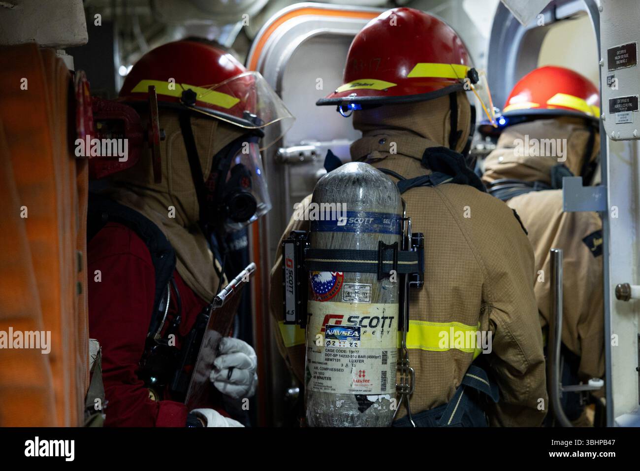 Sailors respond to a simulated engineering casualty in main engine room ...