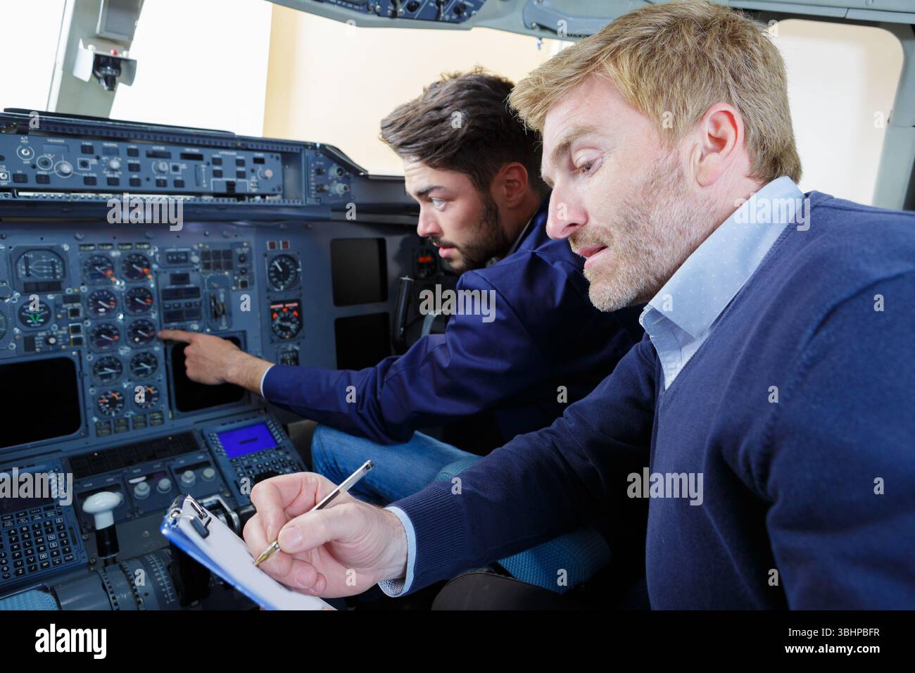 people working on aircraft cockpit Stock Photo - Alamy