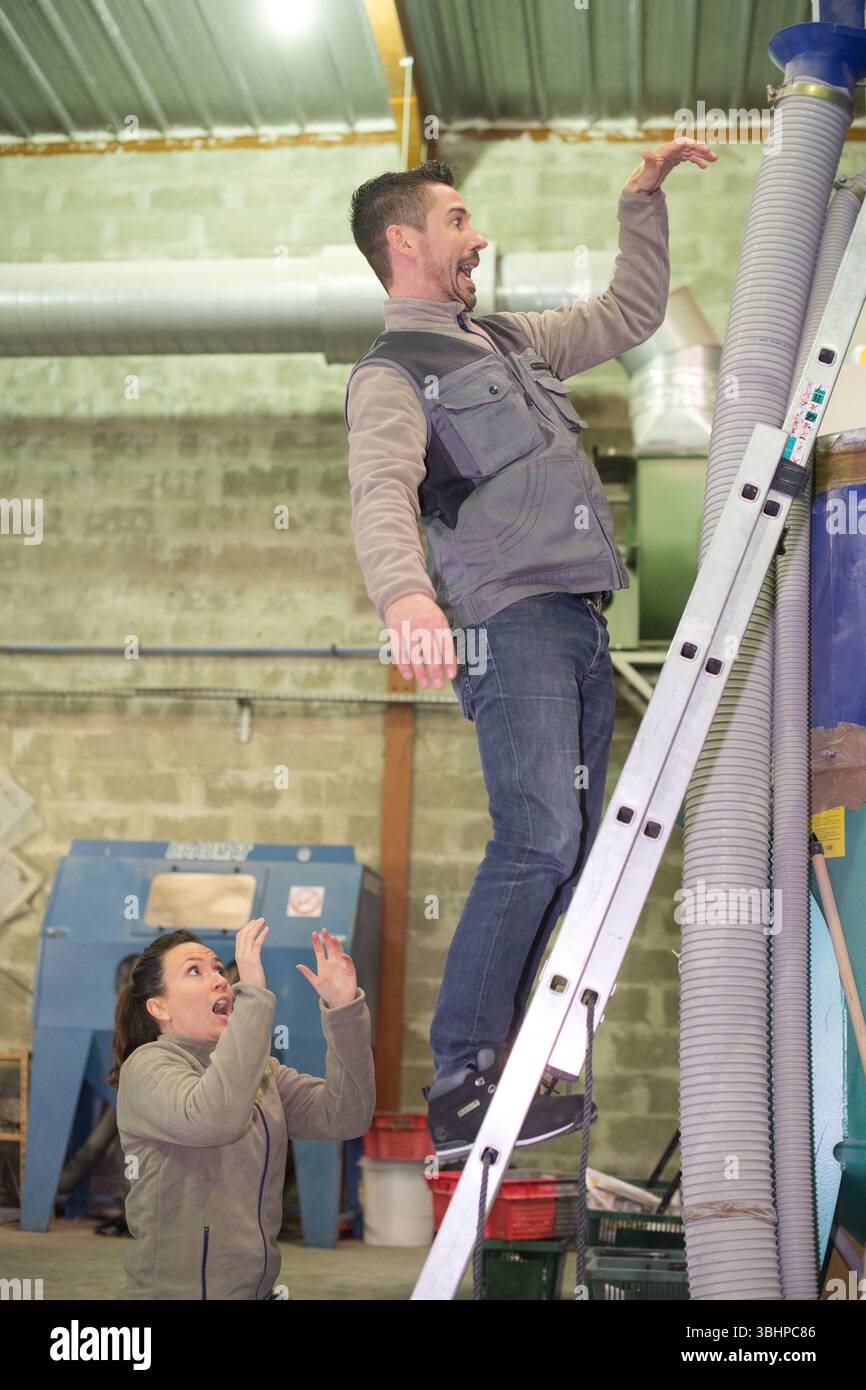 worker falling off of ladder Stock Photo - Alamy