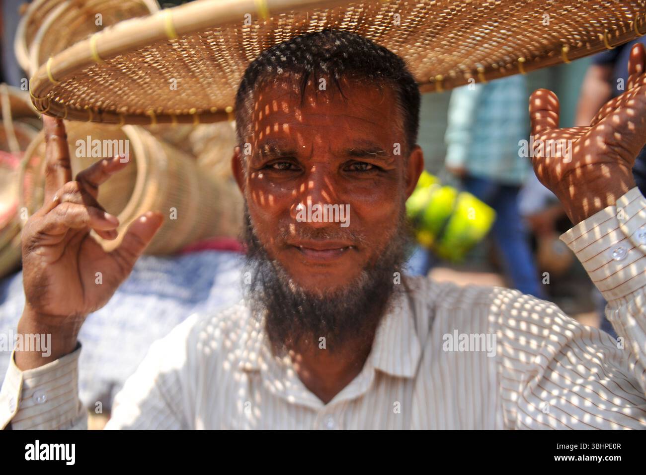 Portrait of a cane product seller in hot weather at the Boishakhi Mela in Laldighi Maidan ...