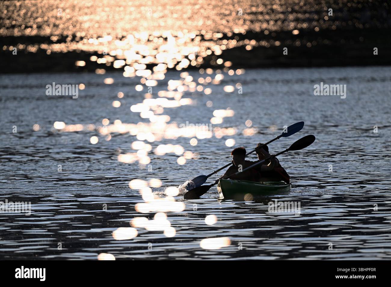 Tourists experience kayaking on the river in Shenyang City, northeast ...
