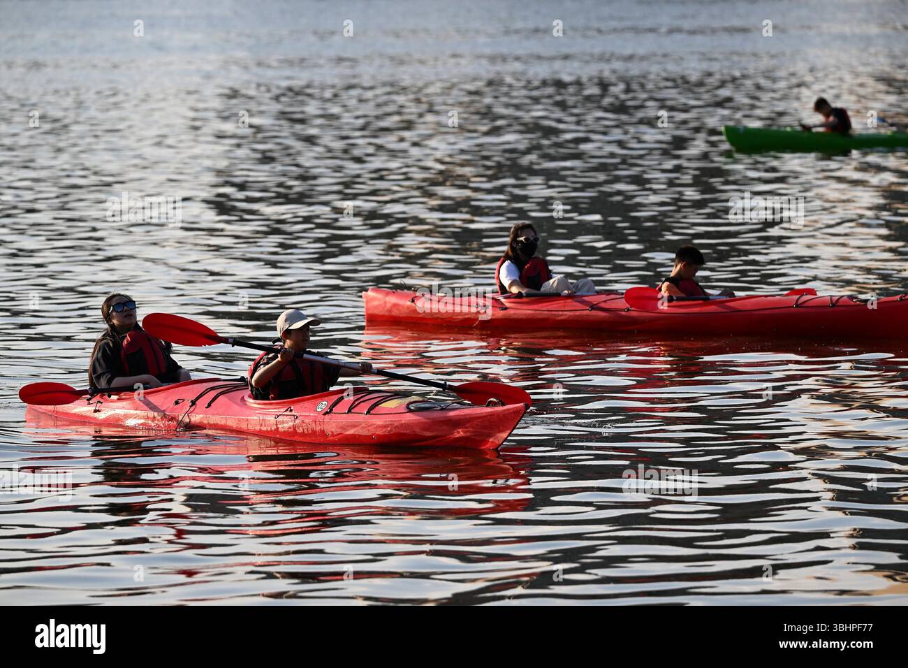 Tourists experience kayaking on the river in Shenyang City, northeast ...