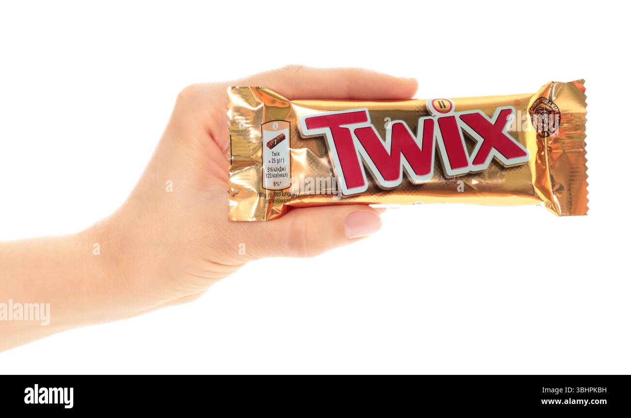 Hand holding Package of the Twix - Chocolate Bar of Mars Incorporated ...
