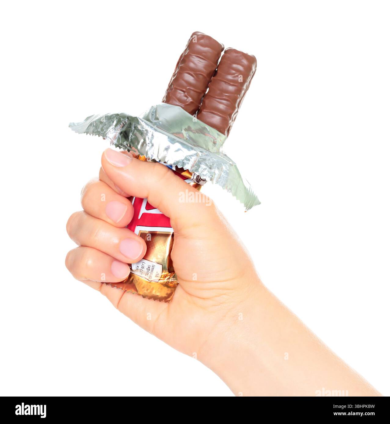 Hand holding Twix open package - Chocolate Bar of Mars Incorporated ...
