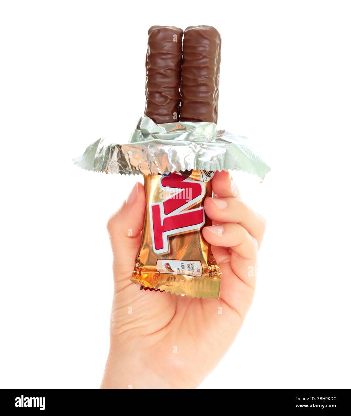 Hand holding Twix open package - Chocolate Bar of Mars Incorporated ...