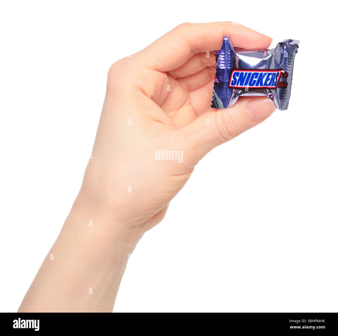 Hand holds Chocolate bar Snickers, isolated on a transparent background ...